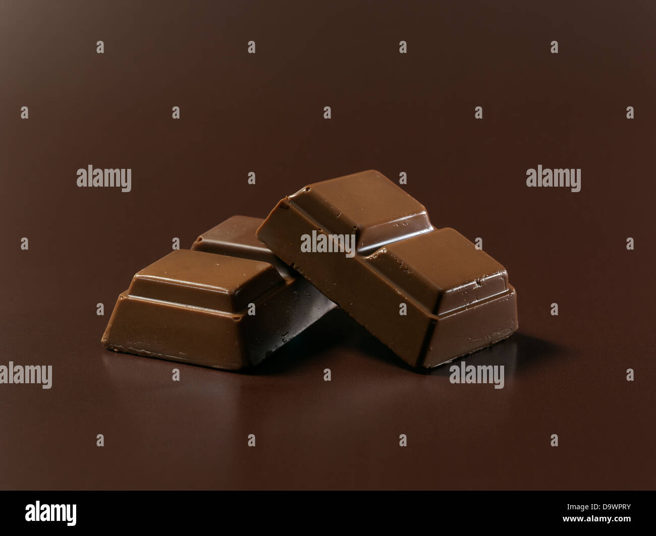Milk chocolate squares Stock Photo - Alamy