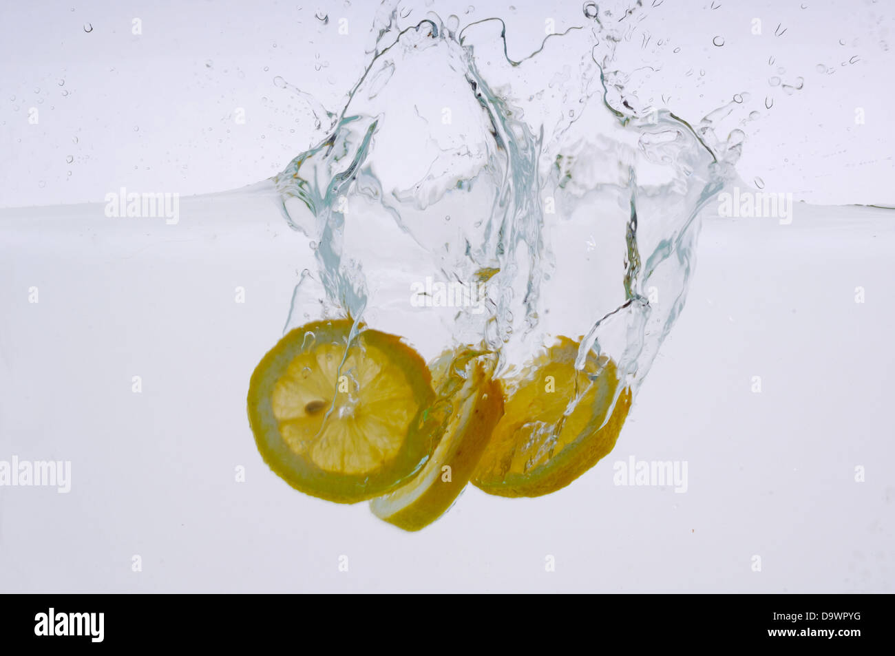 Lemon slices in water Stock Photo - Alamy