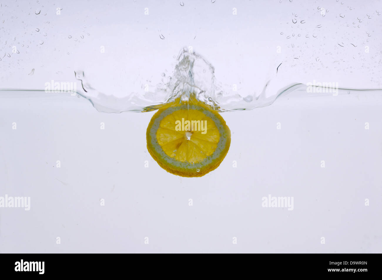 Lemon slices in water Stock Photo - Alamy