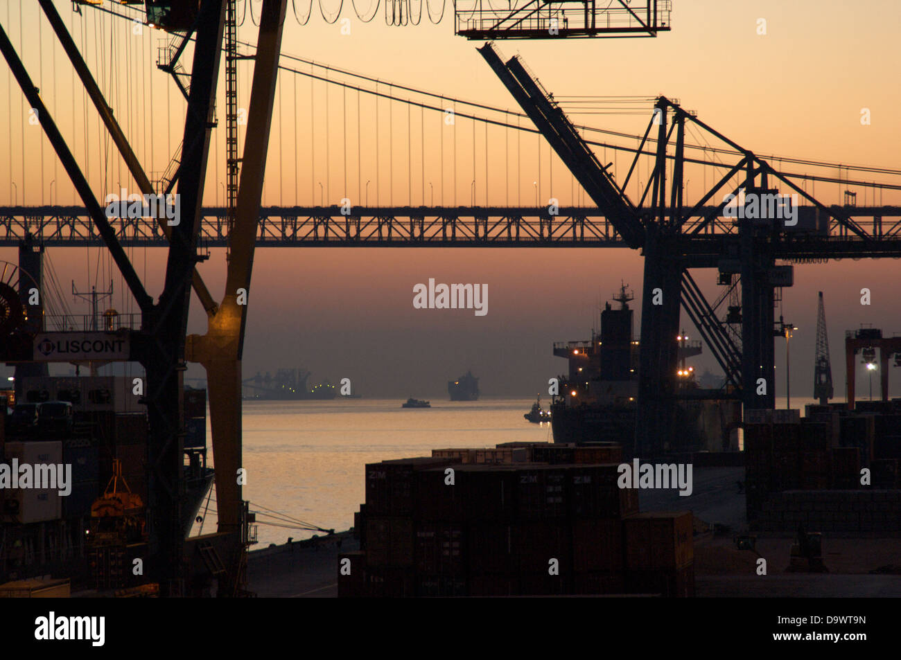 Sunset in the port of Lisbon Stock Photo - Alamy