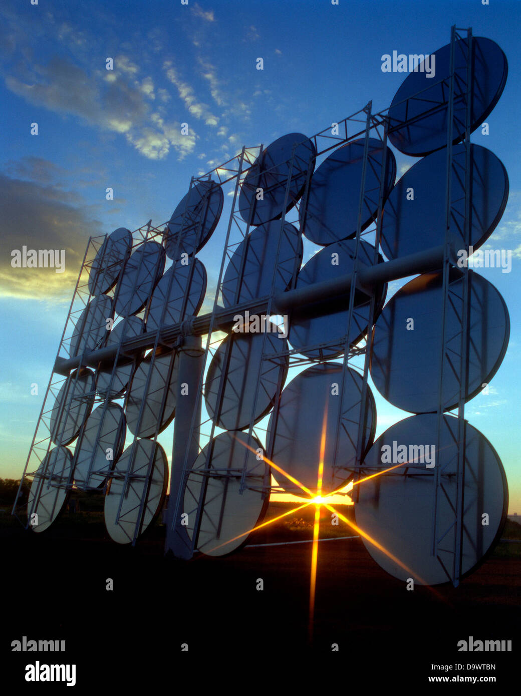 Technicians work on the SAIC built and designed heliostat solar power ...