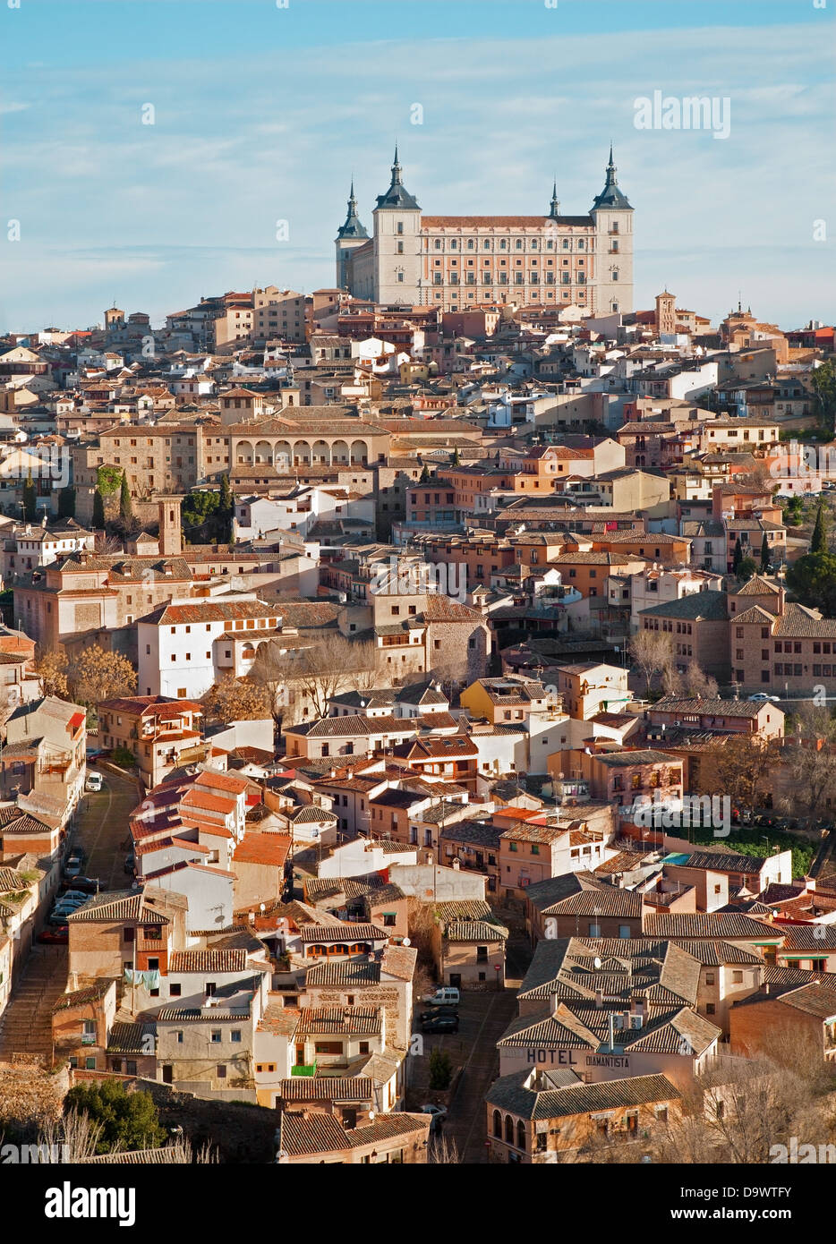 Toledo - Alcazar and town in morning light Stock Photo - Alamy
