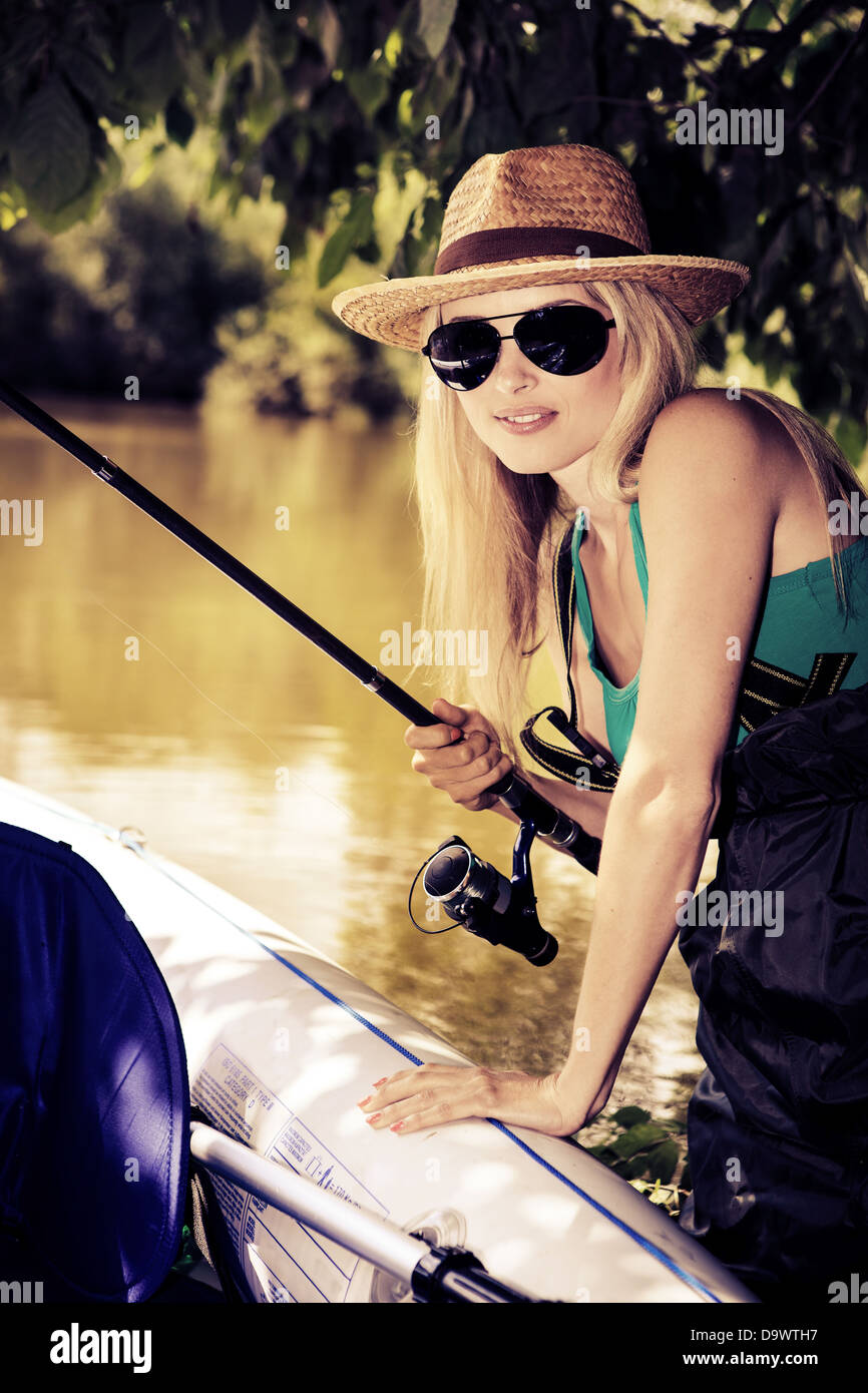 the outdoor portrait of a young fishing woman Stock Photo - Alamy
