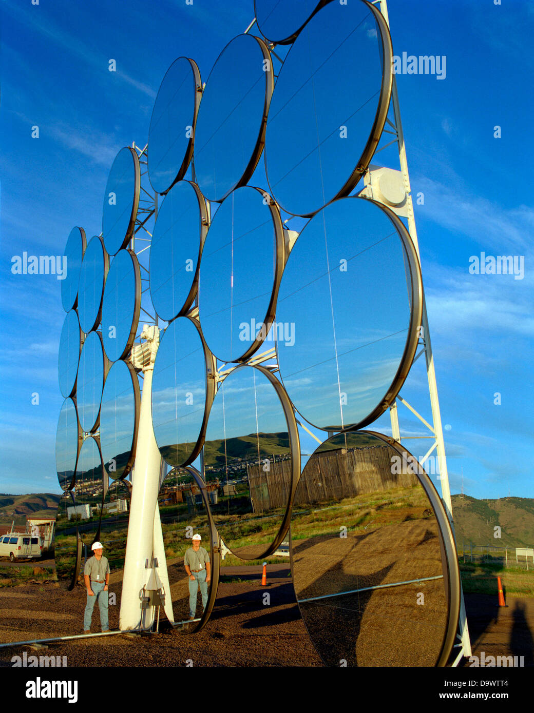 Technicians work on the SAIC built and designed heliostat solar power ...