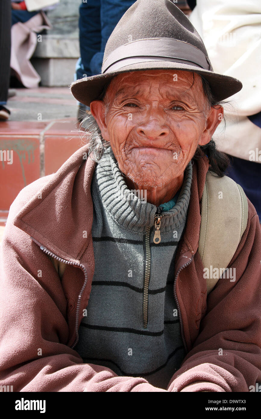 A homeless Hispanic man begging on the street in Cotacachi, Ecuador ...