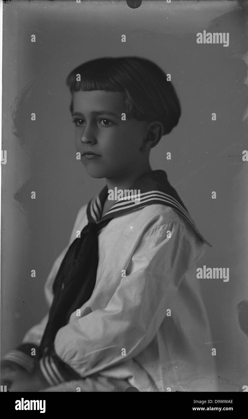 This photograph features an unidentified child, captured in a ...