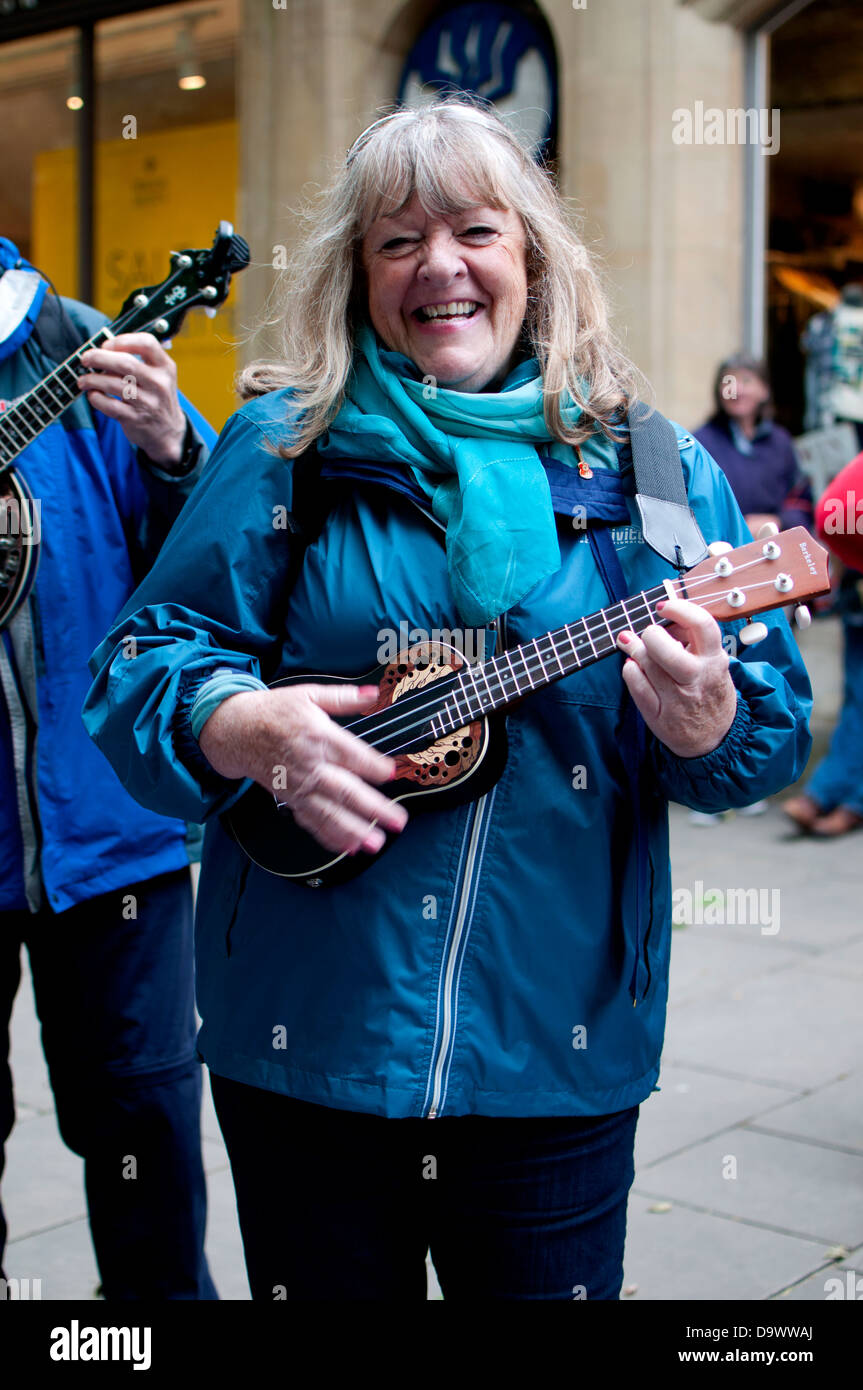 Woman playing ukulele Stock Photo - Alamy