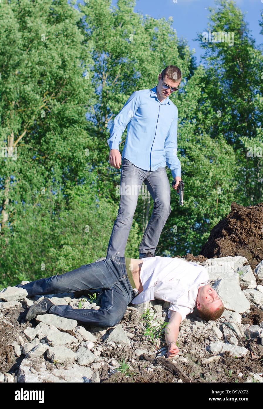 Offender gets rid of the corpse, throws off a cliff Stock Photo - Alamy