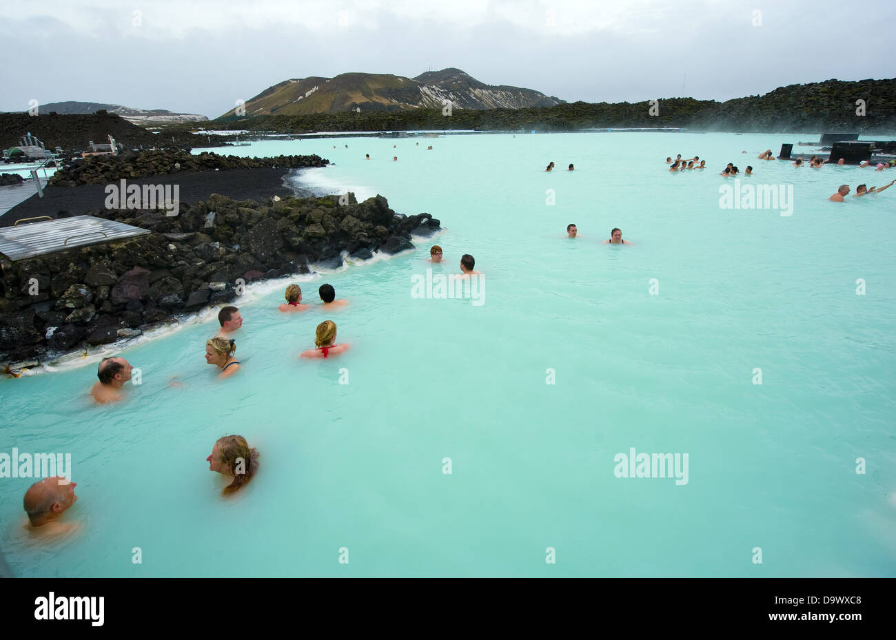 People bathing in the Blue Lagoon geothermal bath resort in Iceland ...