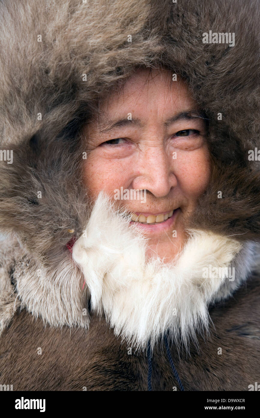 Local resident in traditional outerwear, hand made from seal skins and ...
