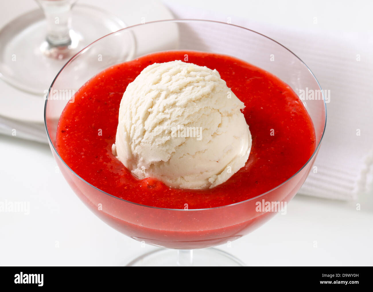 Ice cream with strawberry puree in coupe Stock Photo - Alamy
