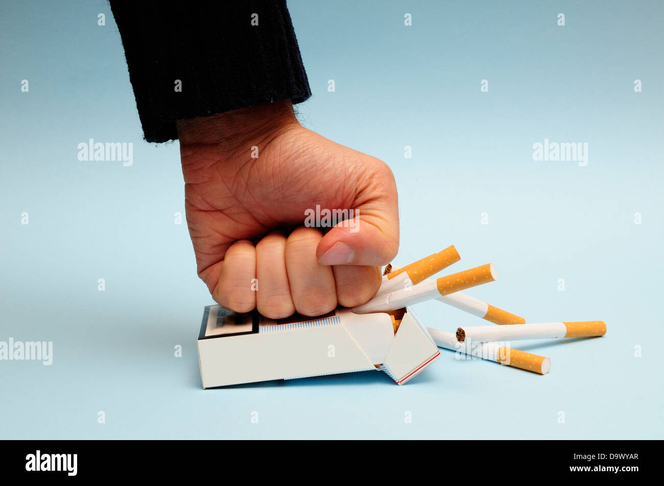 hand smashing a pack of cigarettes, Unsmoke campaign for quitting ...