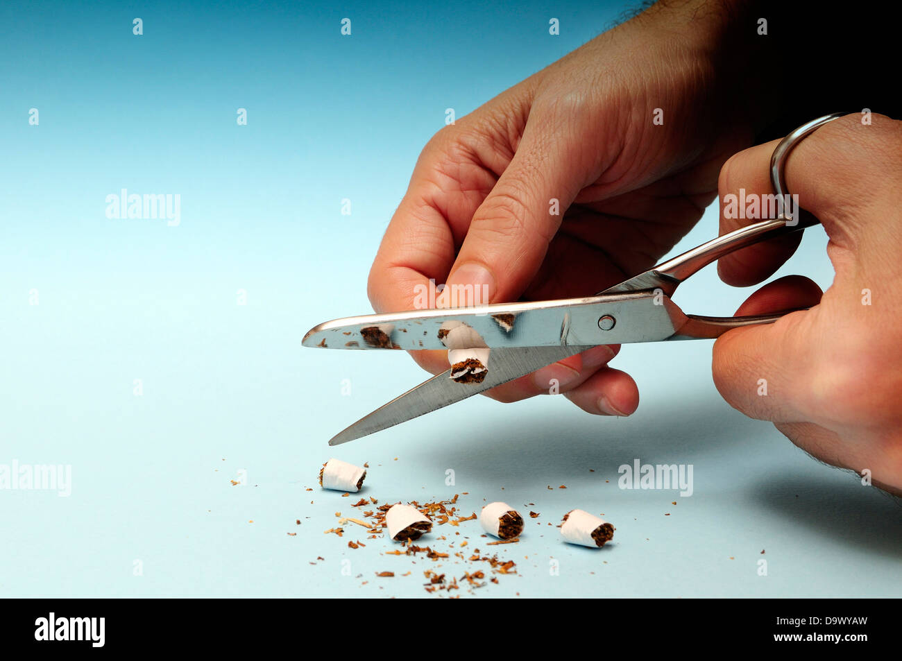 hand cutting a cigarette, Unsmoke campaign concept, quit smoking Stock ...