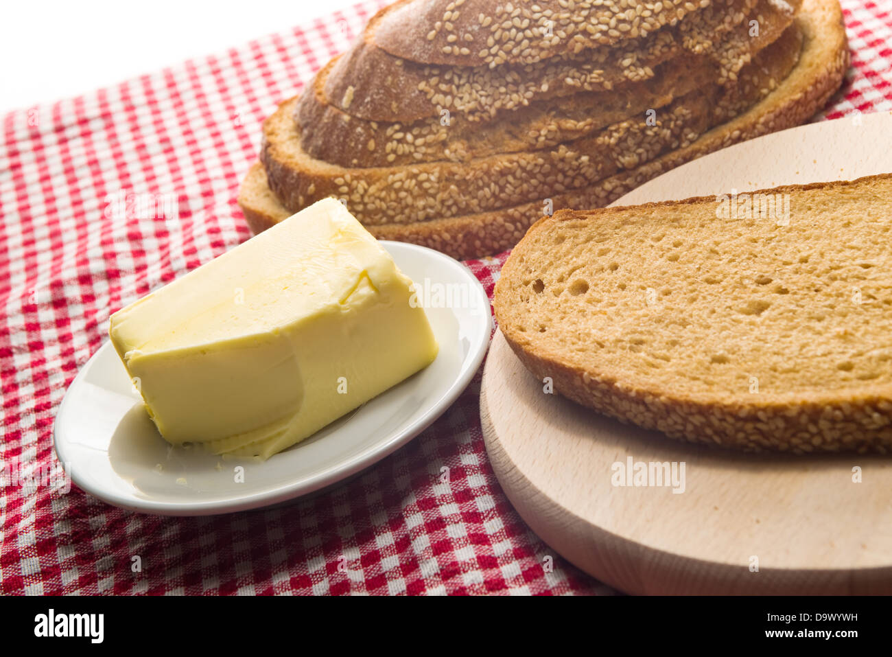 Bread and butter on a table, served for breakfast Stock Photo - Alamy
