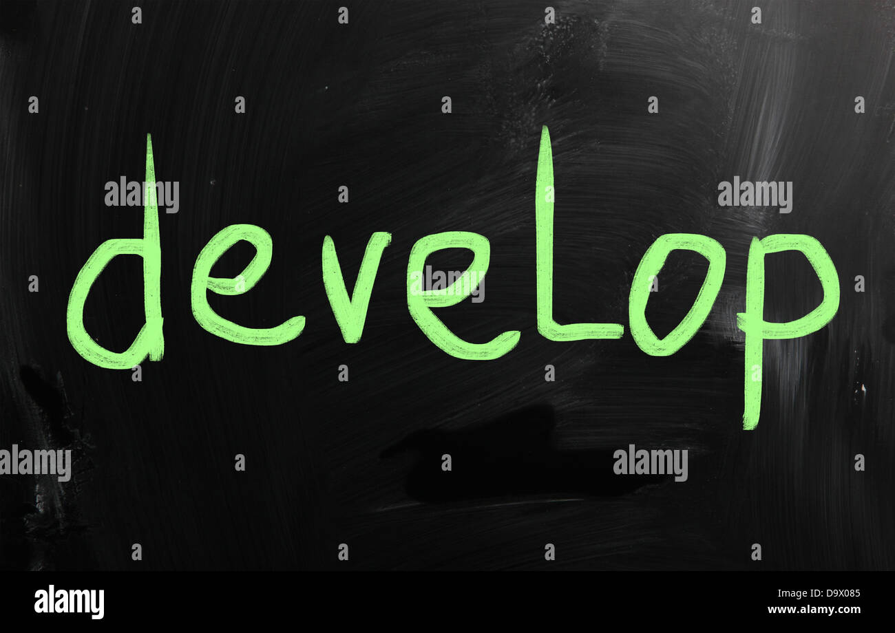 Develop handwritten with white chalk on a blackboard Stock Photo - Alamy