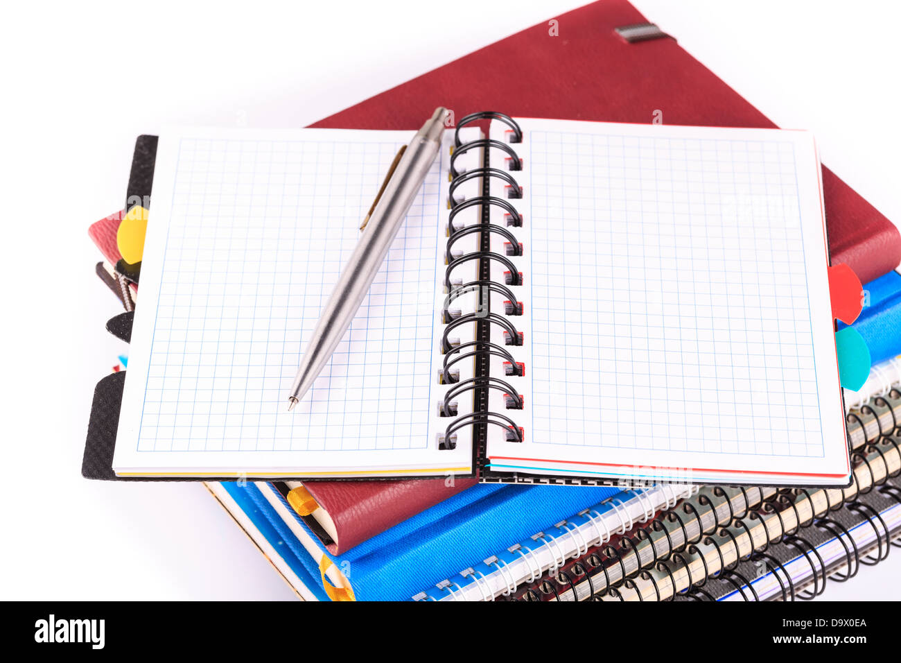 Note book for taking notes with a pen isolated on white Stock Photo - Alamy