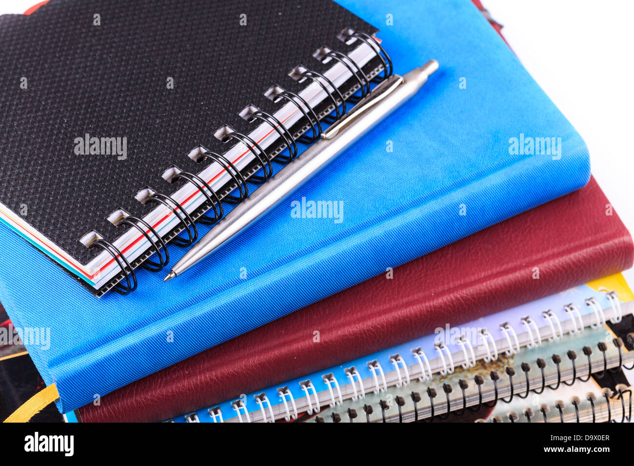 Note book for taking notes with a pen isolated on white Stock Photo - Alamy