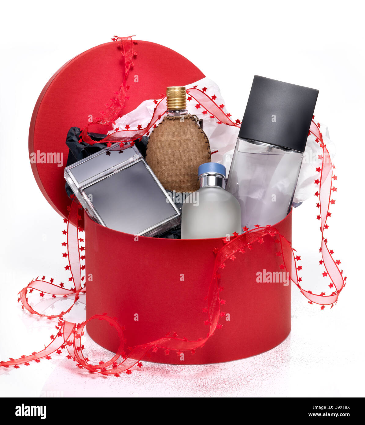 Perfumes in red color festive box Stock Photo - Alamy
