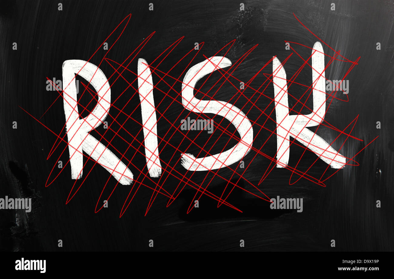 Risk handwritten with white chalk on a blackboard Stock Photo - Alamy