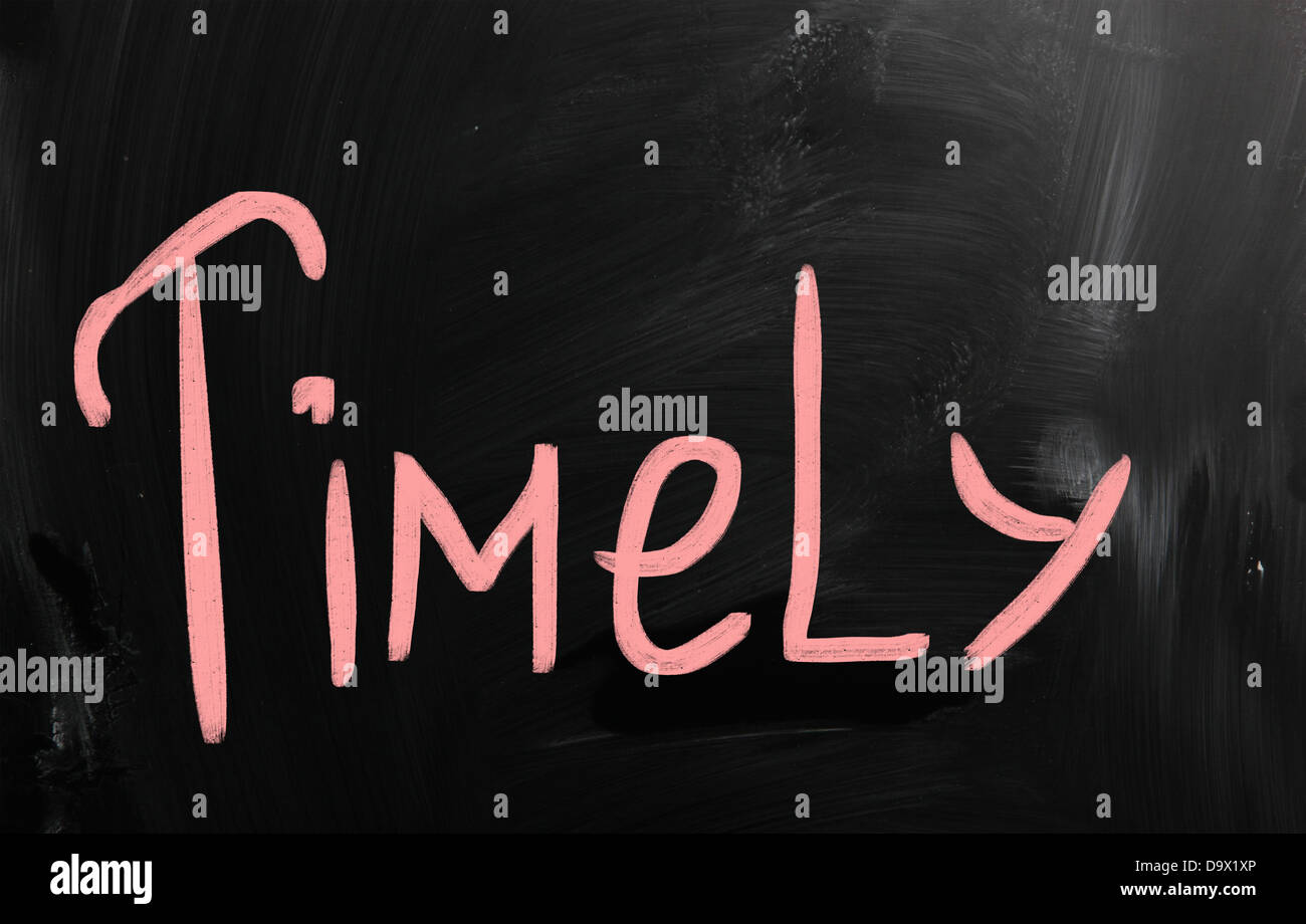Timely handwritten with white chalk on a blackboard Stock Photo - Alamy