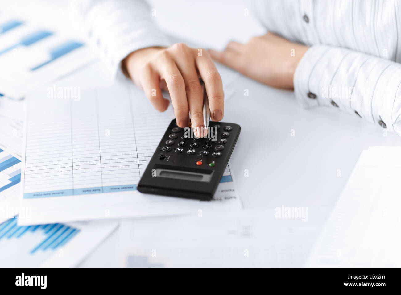 woman hand with calculator and papers Stock Photo - Alamy