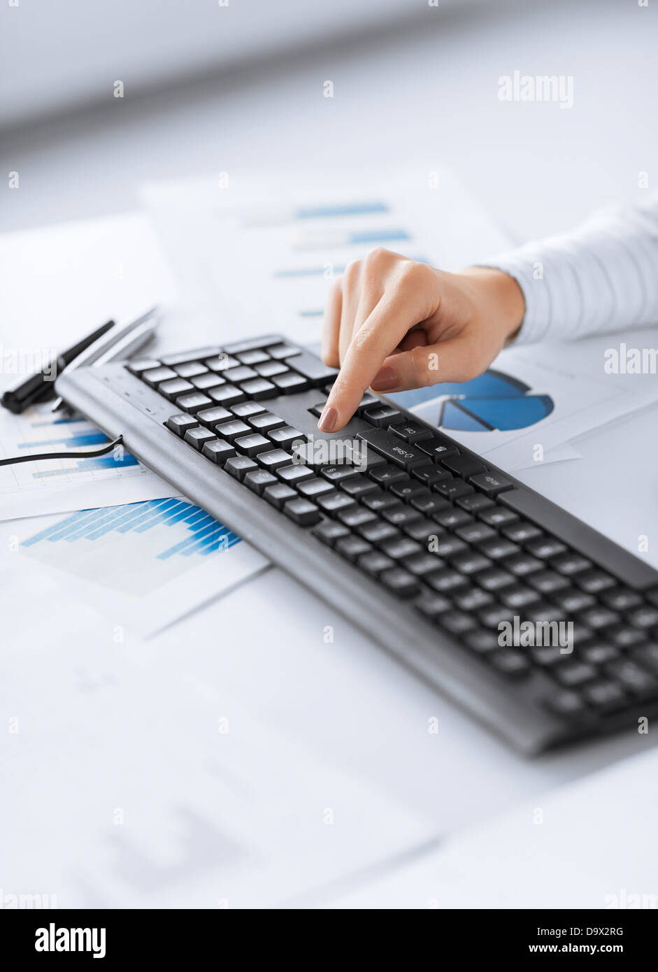 woman hand pressing enter button on keyboard Stock Photo - Alamy