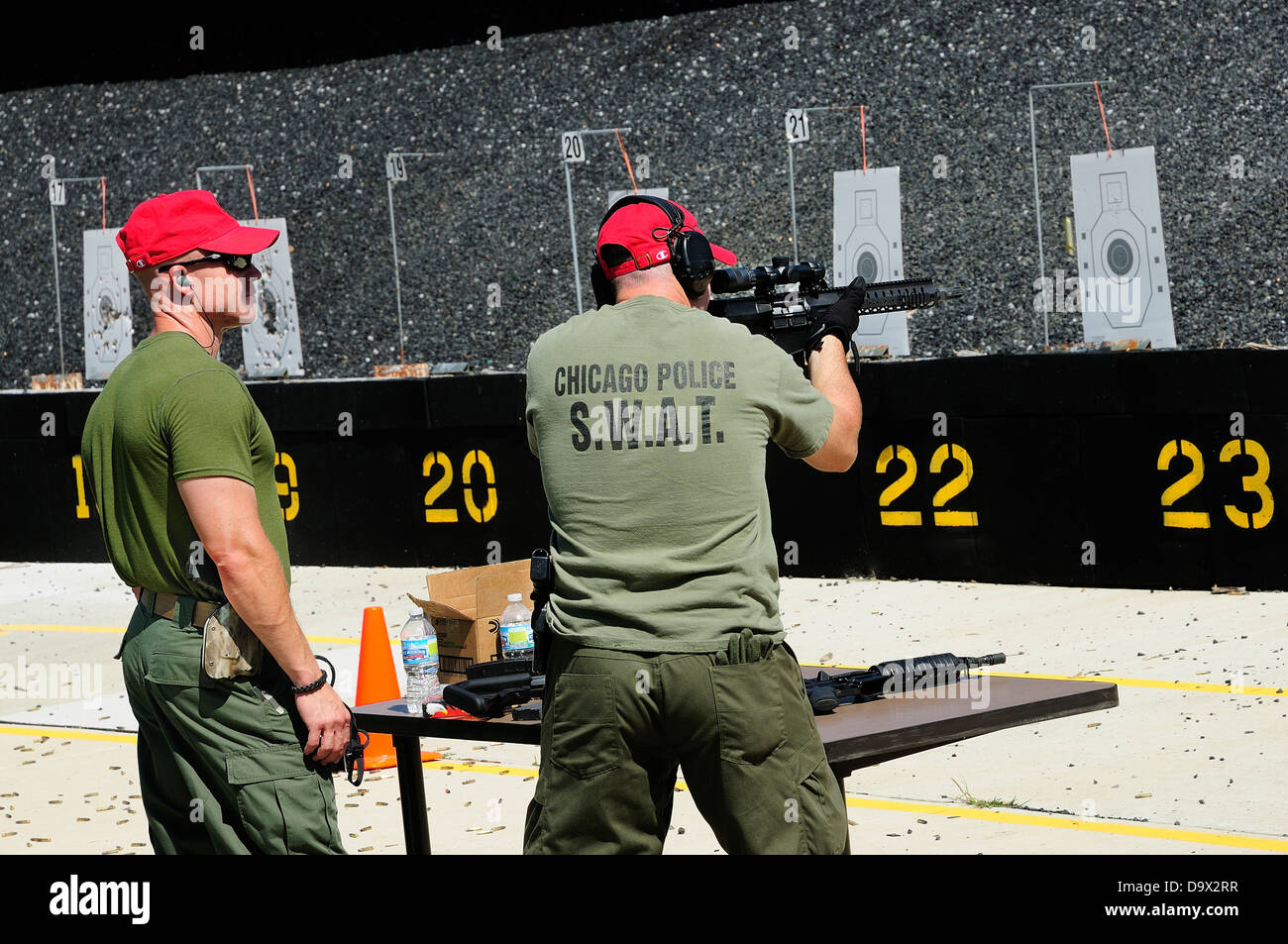 Swat team members shooting automatic rifles or AR's at FBI practice ...