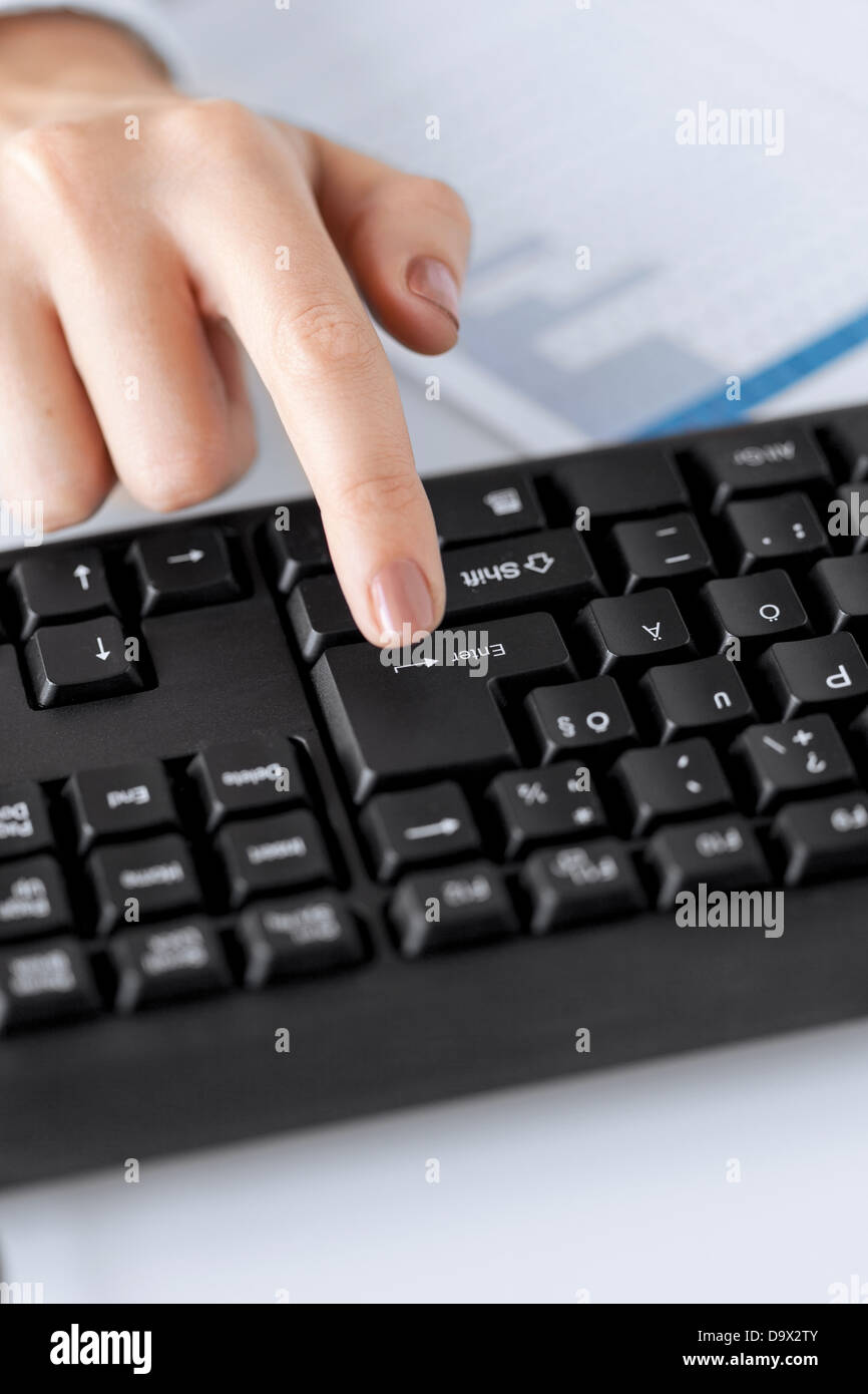 woman hand pressing enter button on keyboard Stock Photo - Alamy