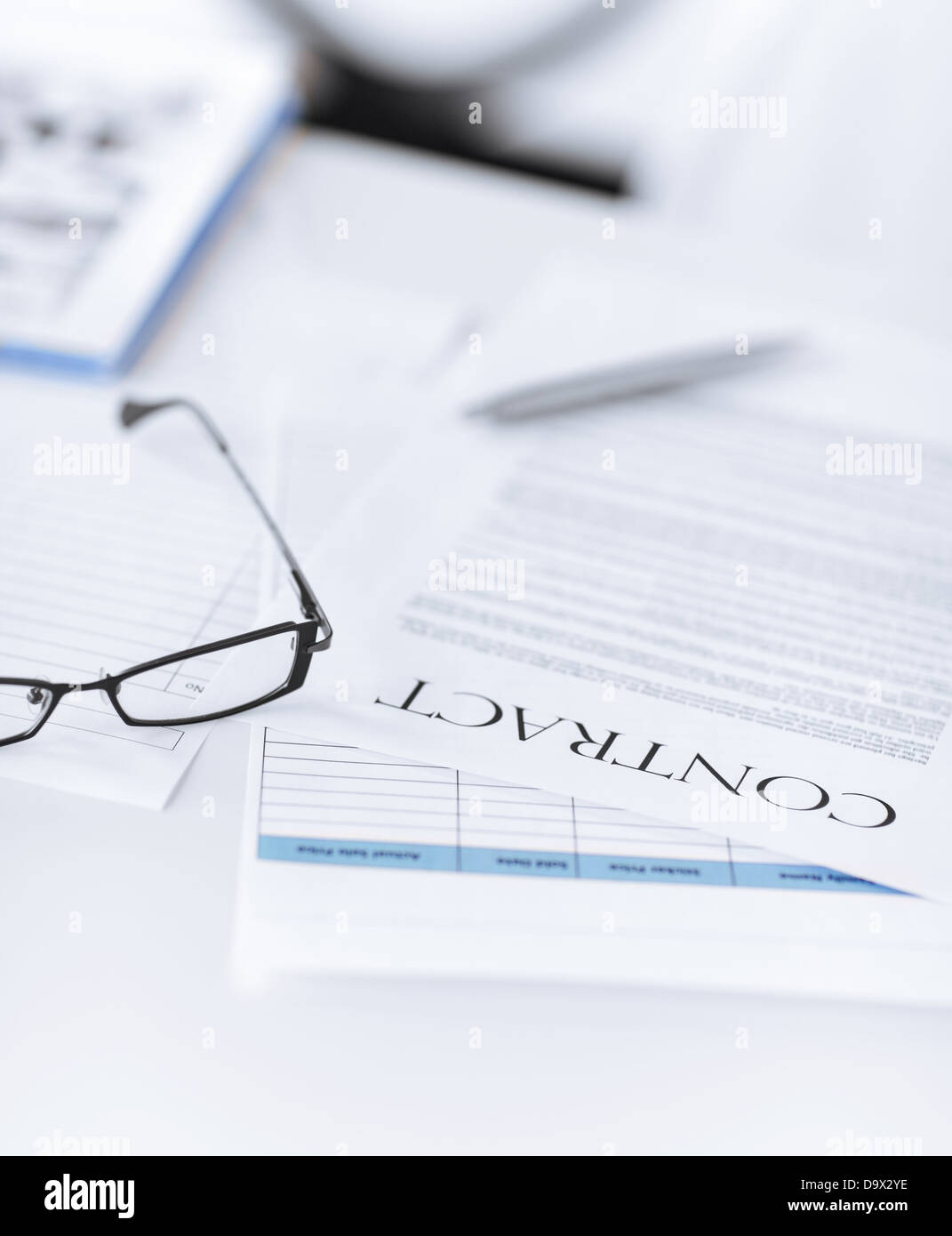 signed contract paper with glasses Stock Photo - Alamy