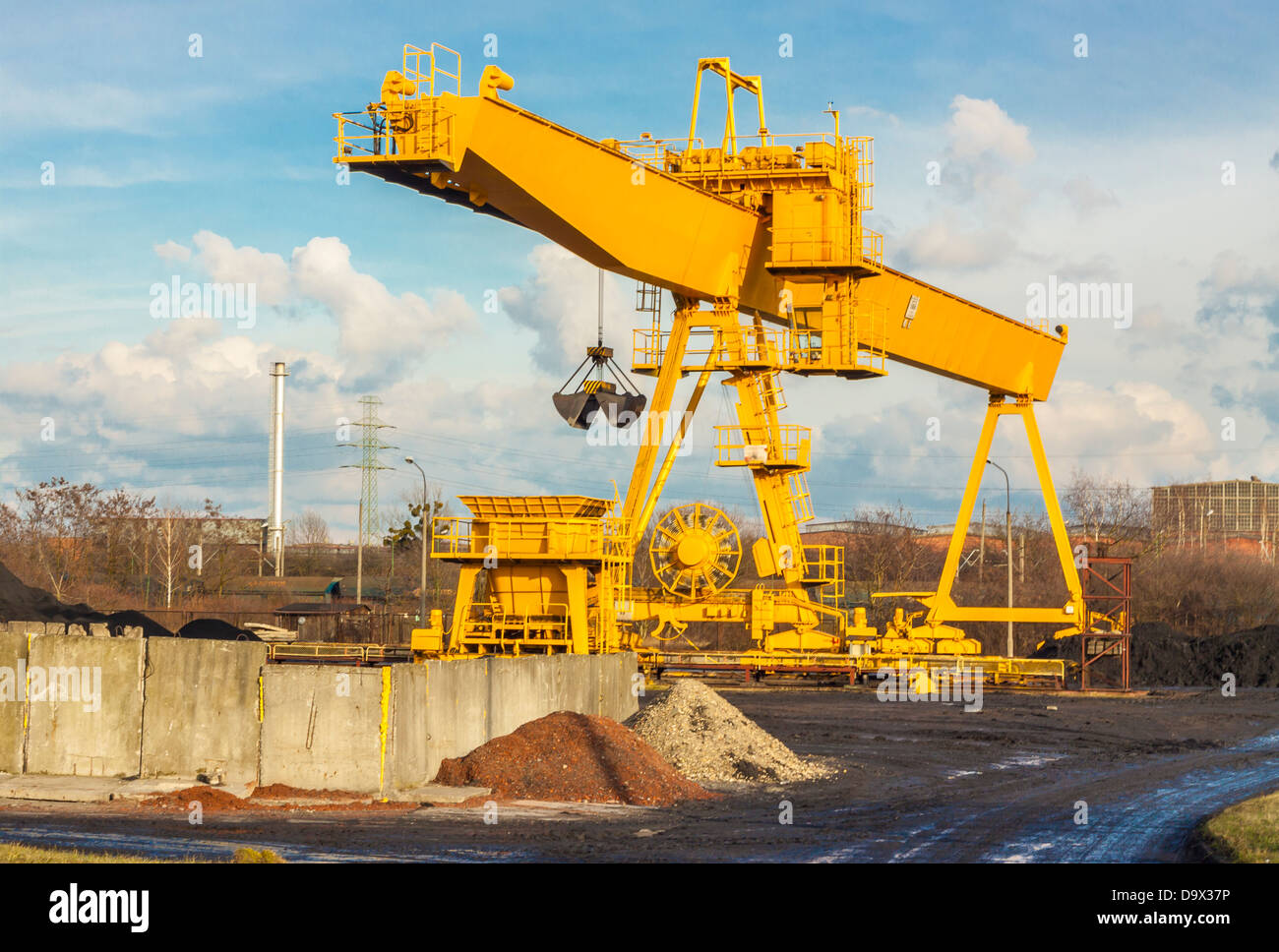 Yellow gantry crane on coal site in heating plant - Poland Stock Photo ...