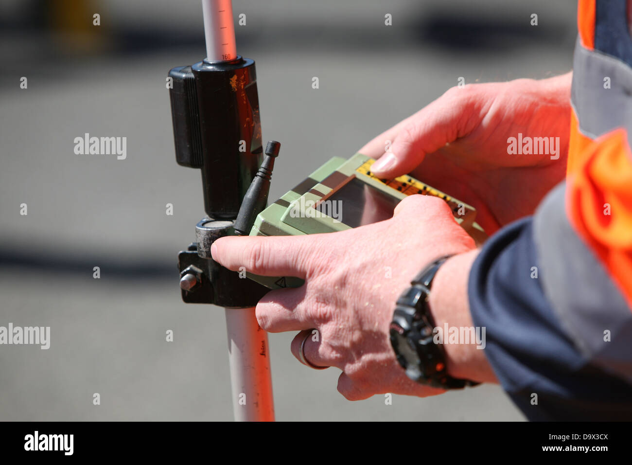 Construction worker using handheld hi-res stock photography and images ...