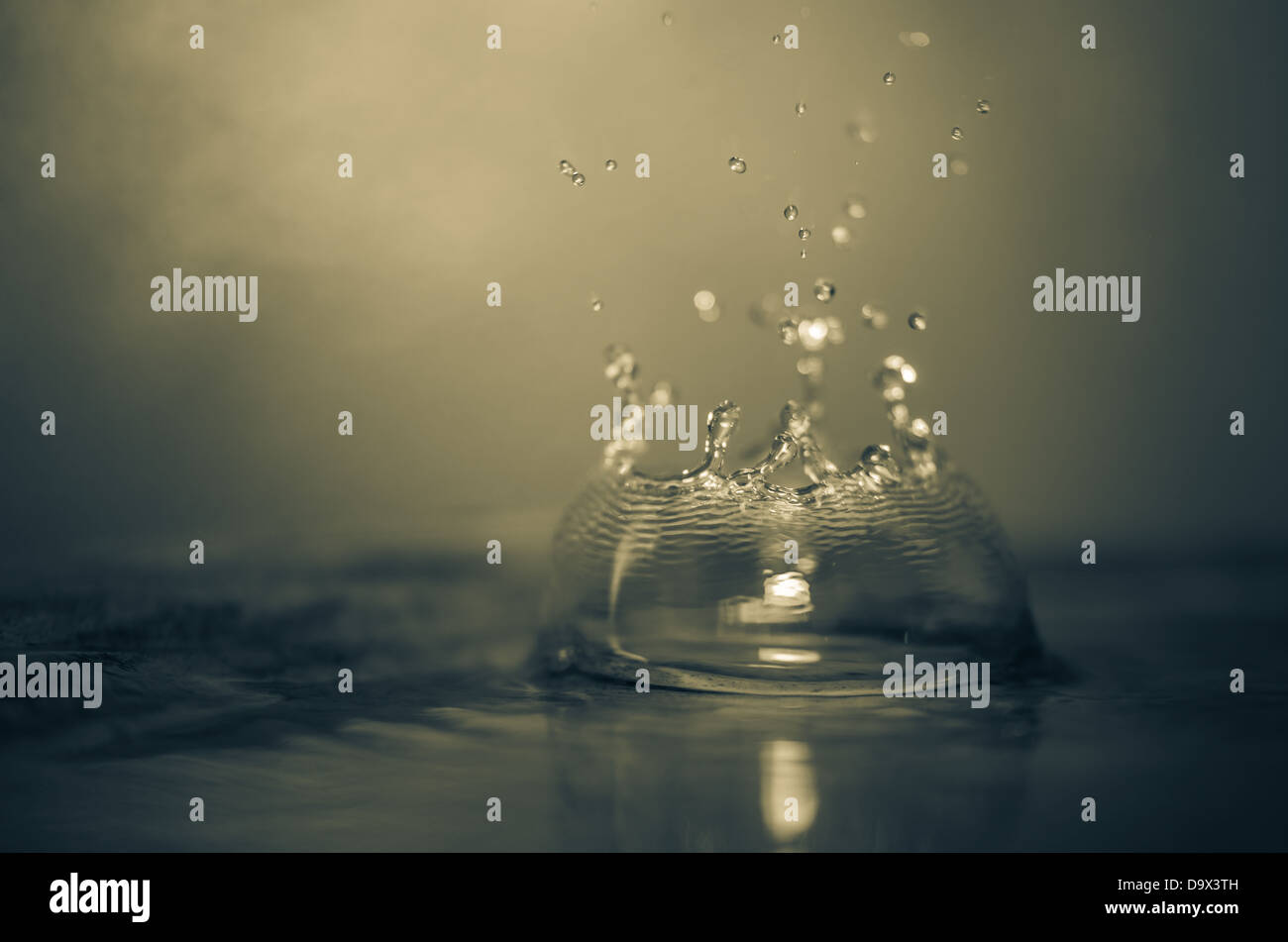 Water splash in the vintage color concept background Stock Photo - Alamy