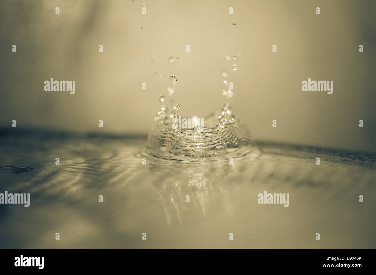 Water splash in the vintage color concept background Stock Photo - Alamy