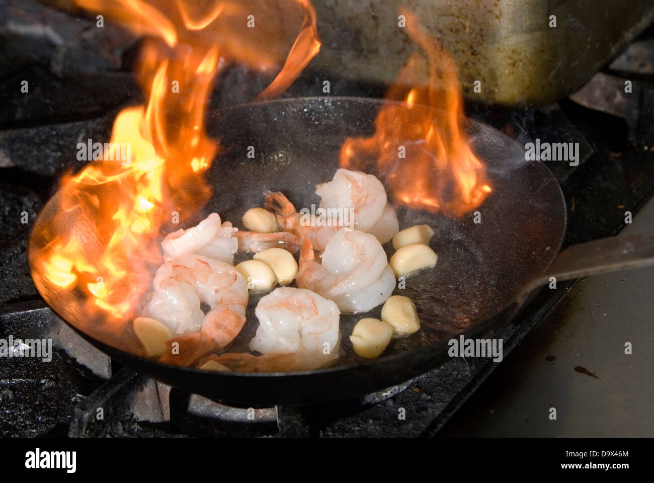 Shrimp being cooked at a restaurant Stock Photo - Alamy