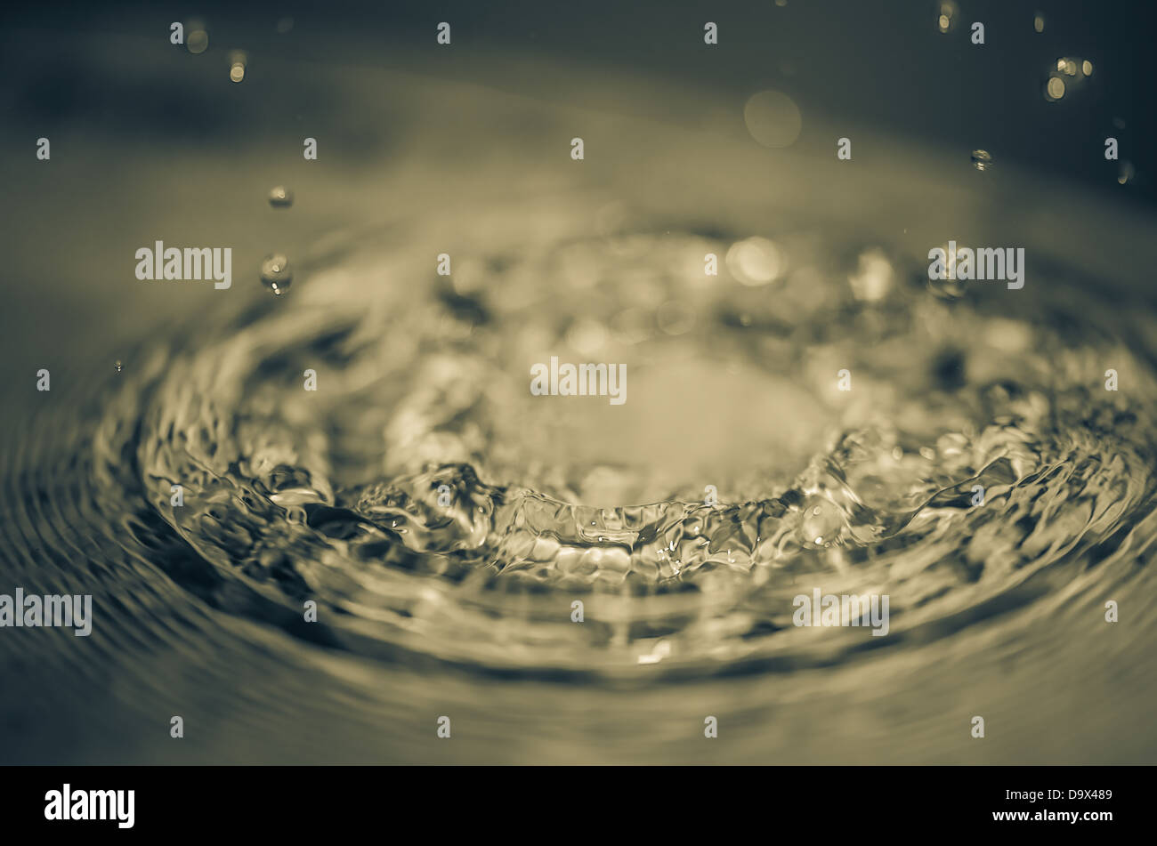 Water splash in the vintage color concept background Stock Photo - Alamy