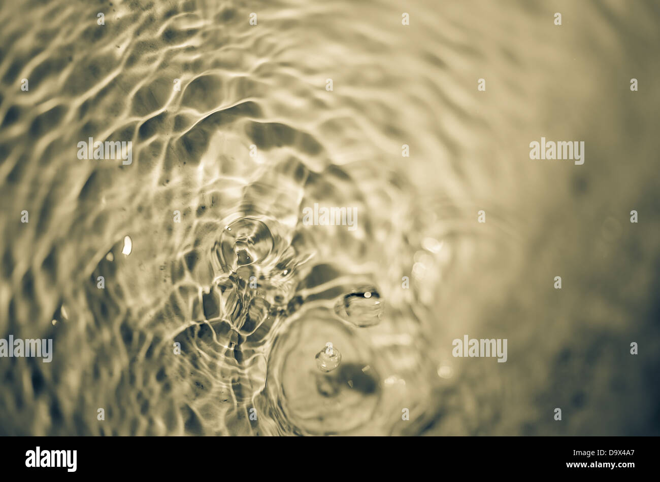 Water splash in the vintage color concept background Stock Photo - Alamy