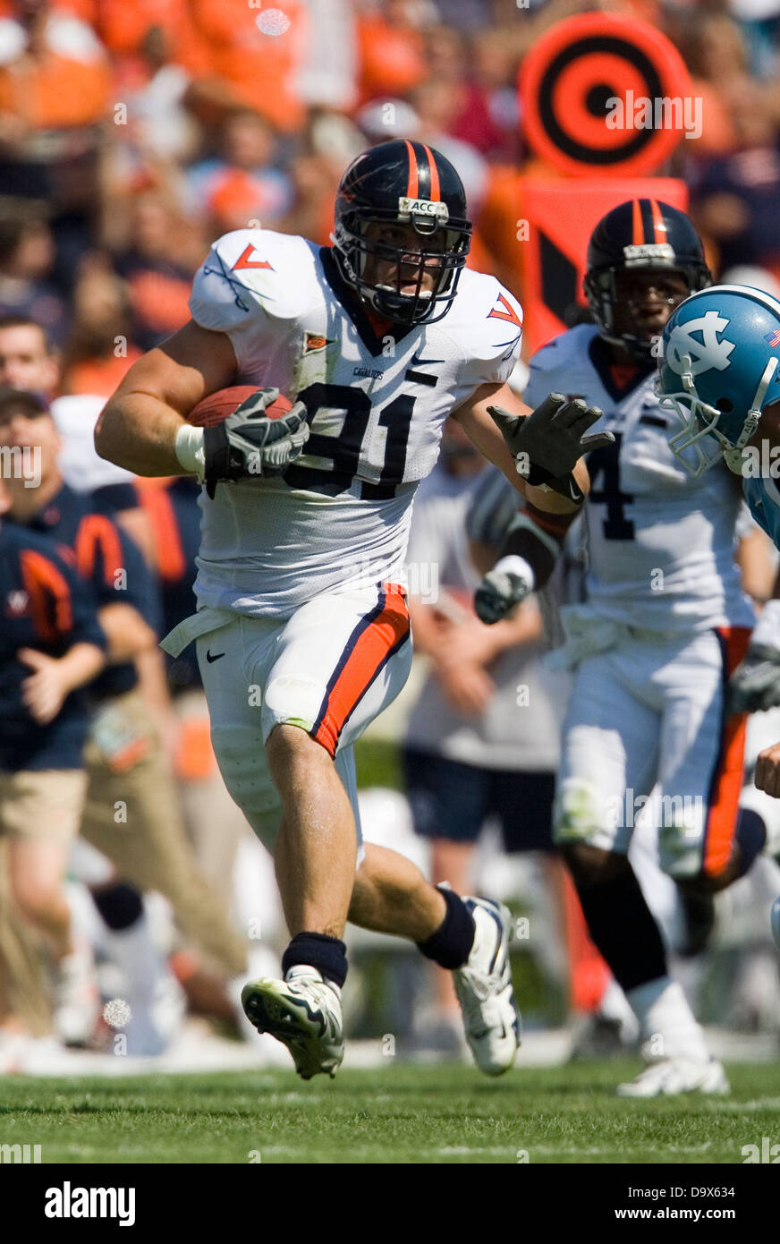 Virginia defensive end Chris Long (91) returns an interception at Kenan ...