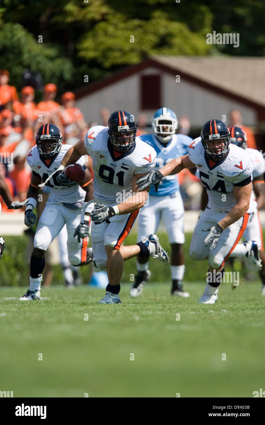 Virginia defensive end Chris Long (91) returns an interception at Kenan ...