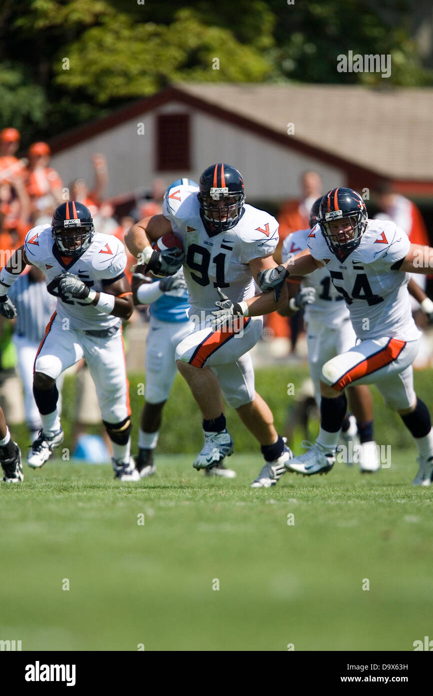 Virginia defensive end Chris Long (91) returns an interception at Kenan ...