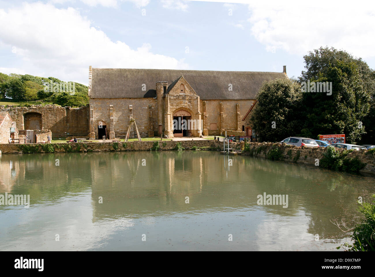Thatched Tithe Barn and pond Abbotsbury Dorset England UK Stock Photo ...