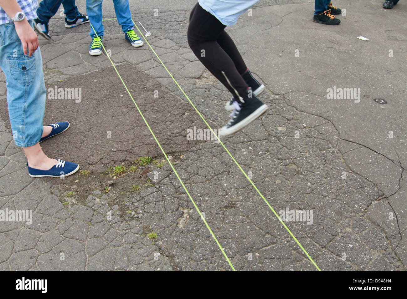 Playing with rubber rope Stock Photo - Alamy