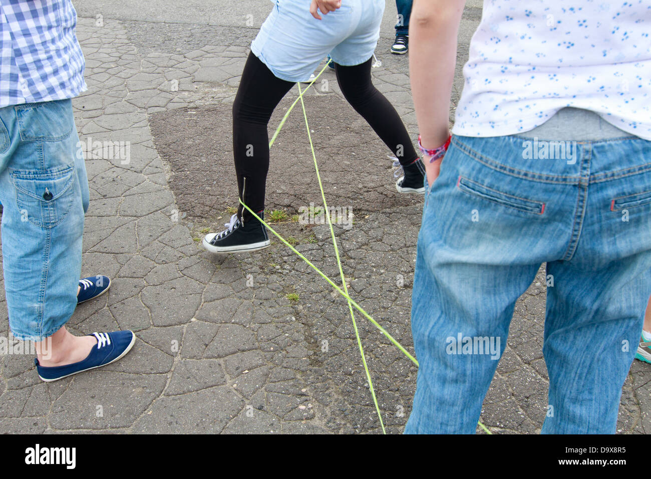 Playing with rubber rope Stock Photo - Alamy