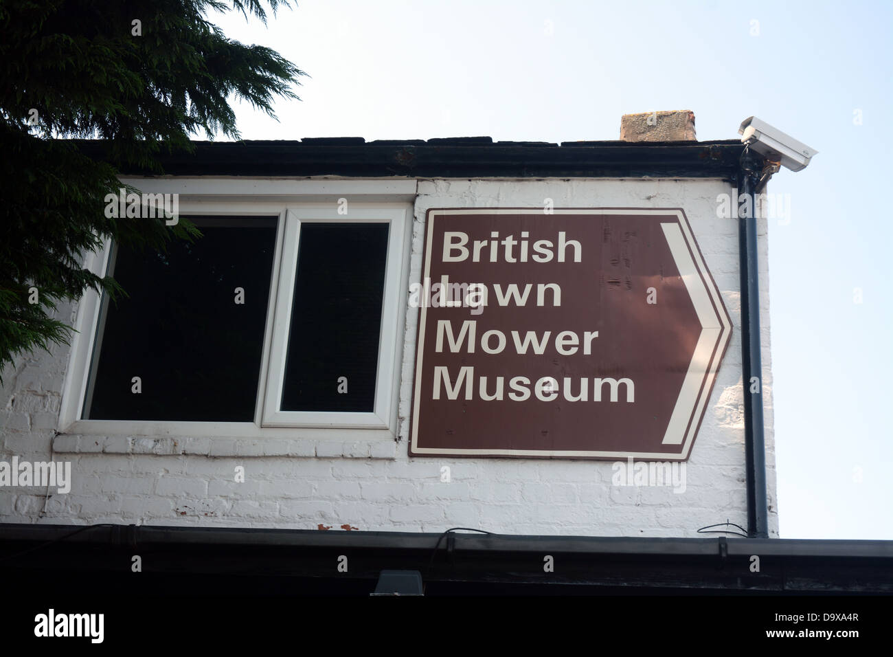A sign indicating the British Lawn Mower Museum Stock Photo - Alamy