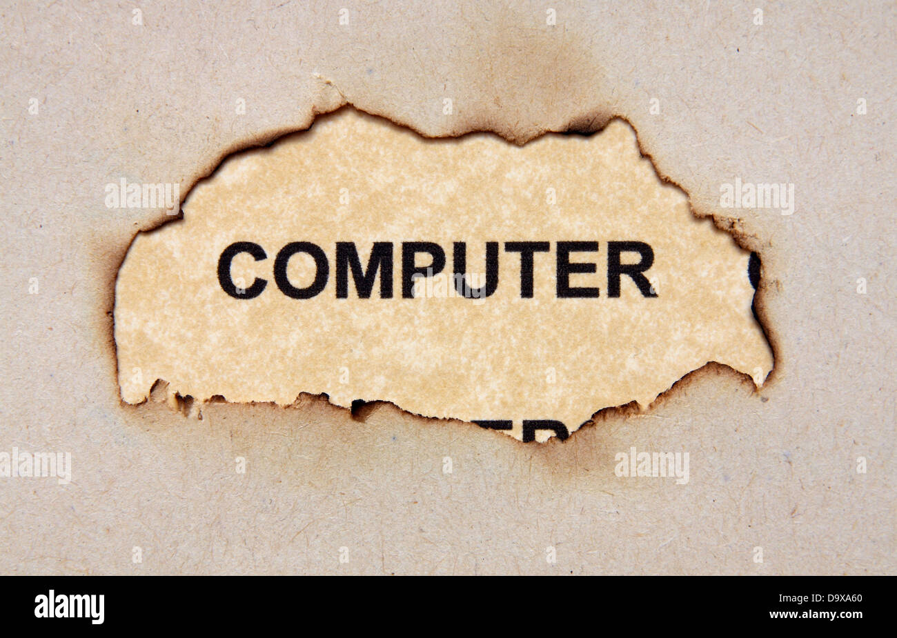 Computer text in paper hole Stock Photo - Alamy