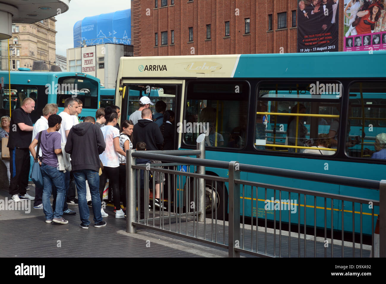 People queuing to get on a bus in Liverpool Stock Photo - Alamy