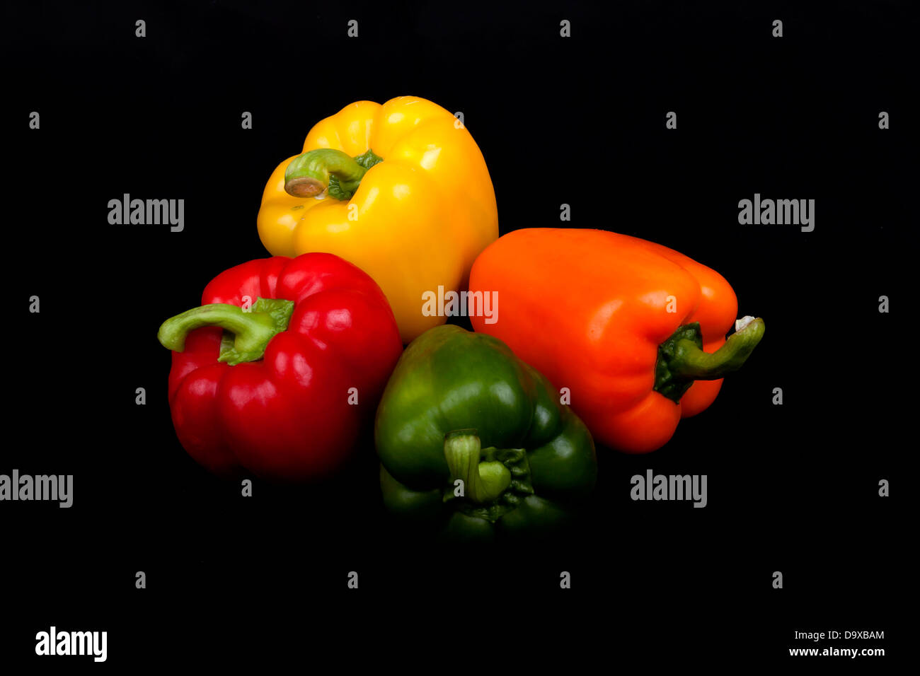 Multi-Colors peppers isolated on a black background Stock Photo - Alamy