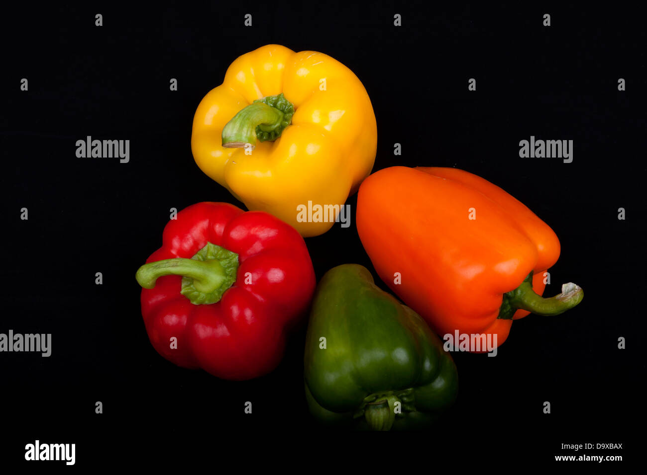 Multi-Colors peppers isolated on a black background Stock Photo - Alamy