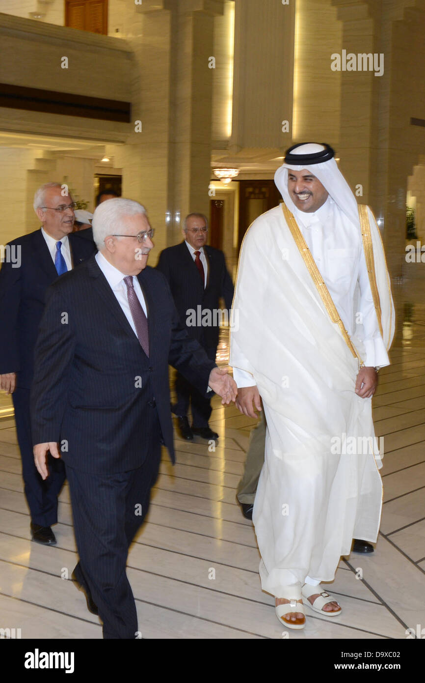 June 27, 2013 - Doha, Doha, Qatar - Palestinian President Mahmoud Abbas walks with Qatar's Emir ...