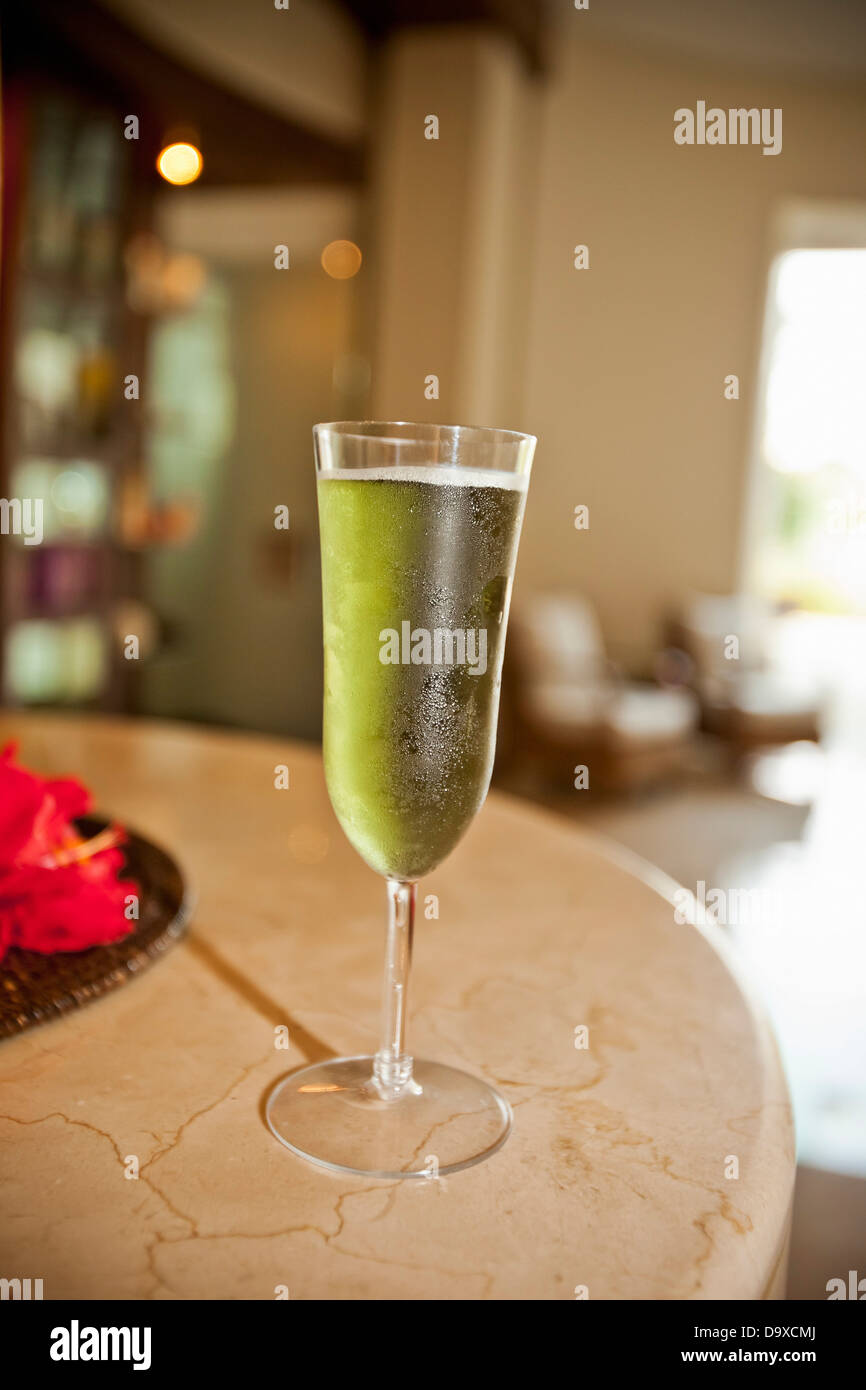 Drink in tall flute glass on table Stock Photo - Alamy