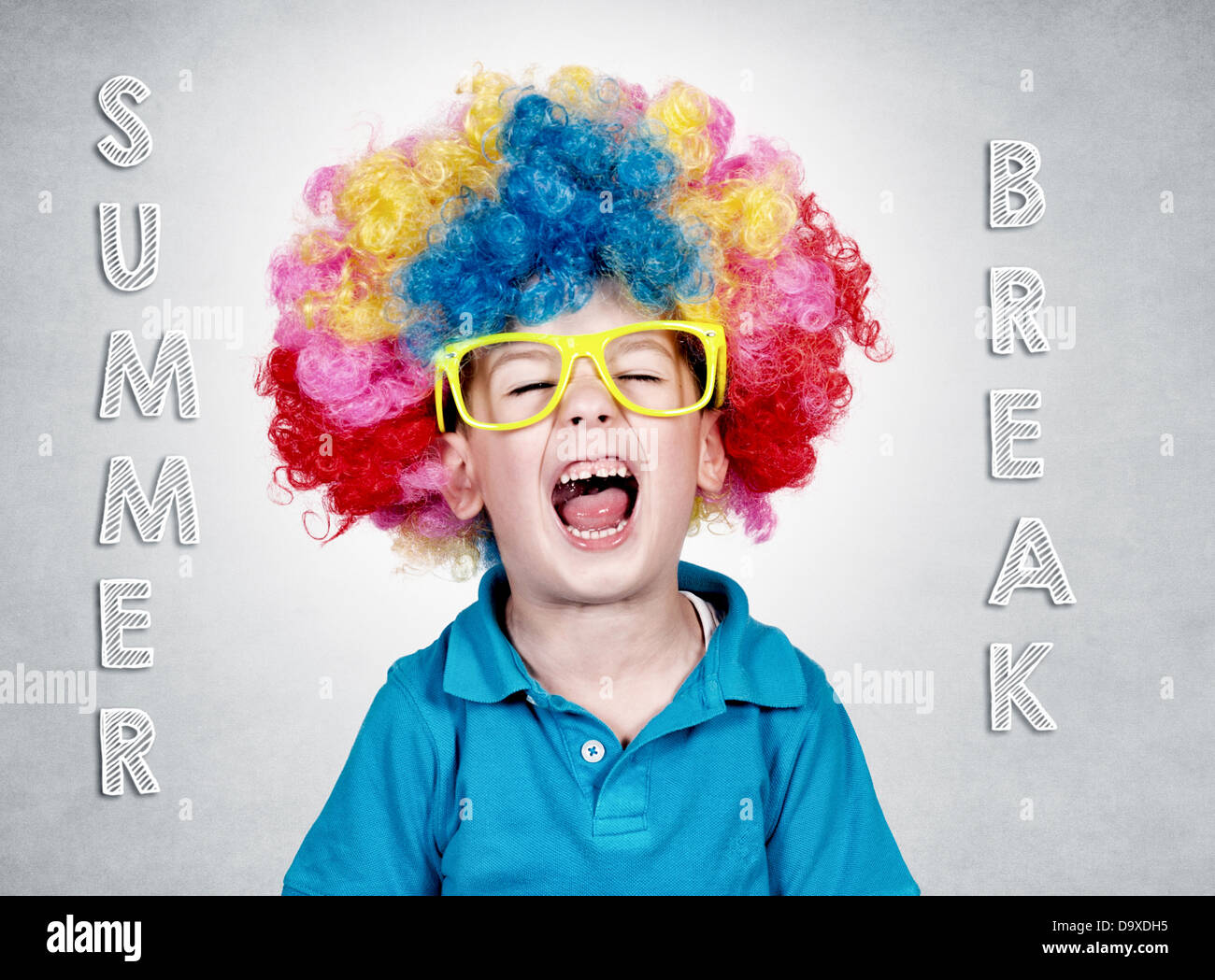 Happy boy with clown wig on summer break Stock Photo - Alamy